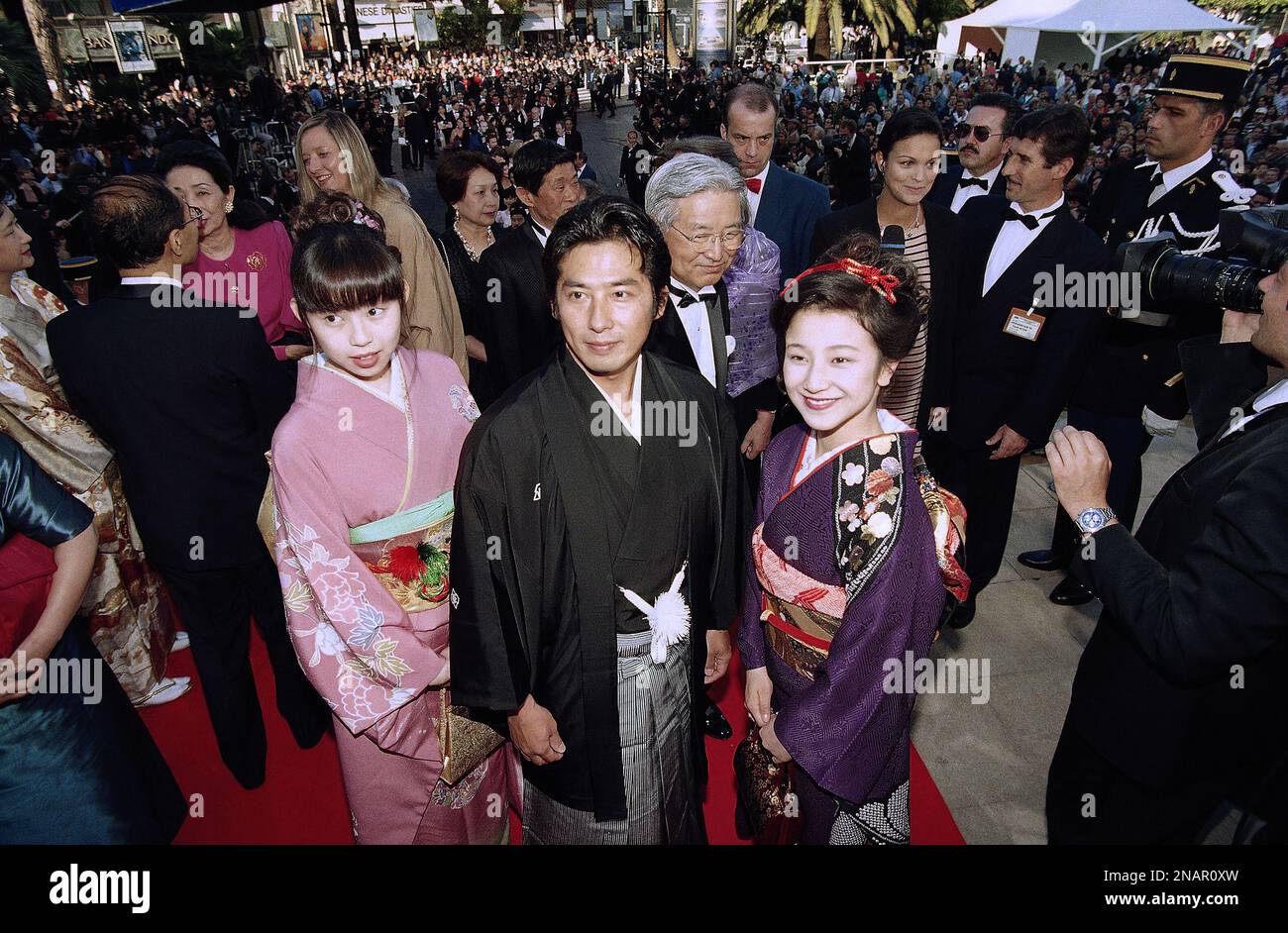 Japanese actor Hiroyuki Sanada, center, arrives at the festival palace ...