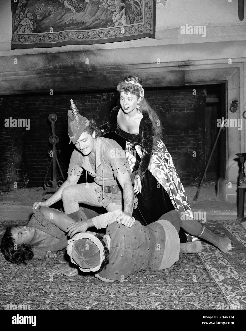 Robin Hood, portrayed by Robert Clarke, bests the ruffians who were ...