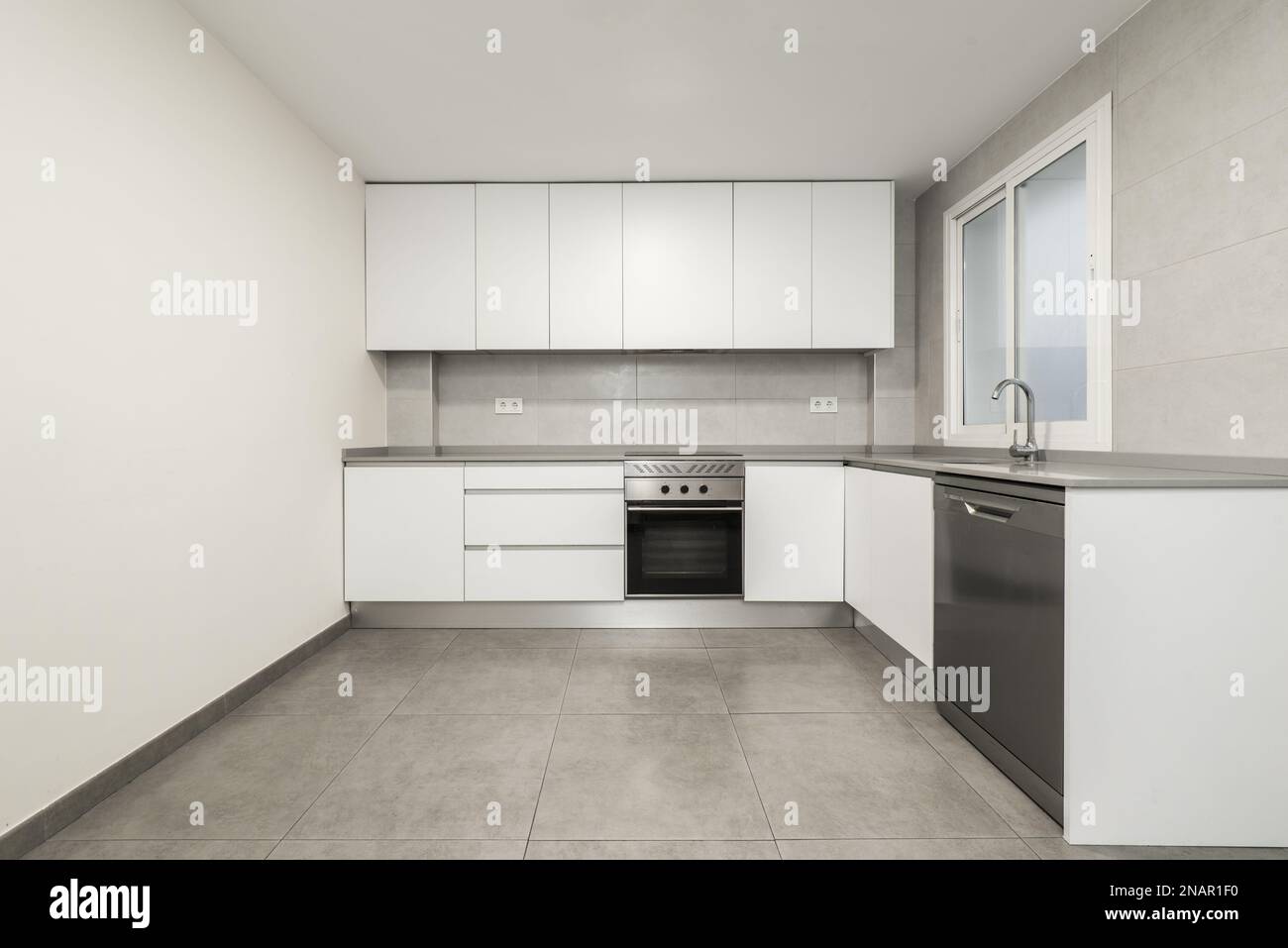 apartment kitchen with white cabinets window over sink, built-in ...
