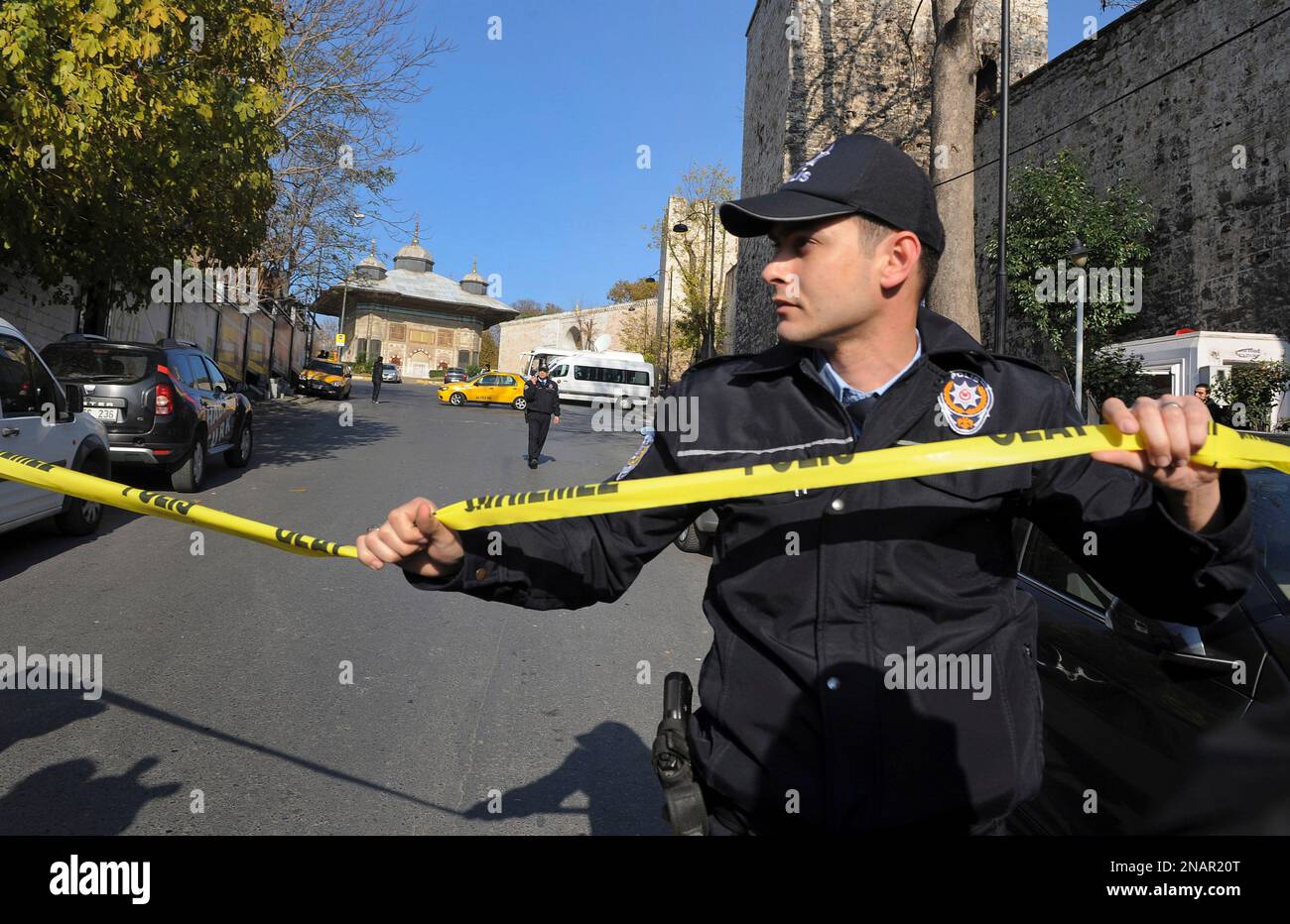 A Turkish police officer cordons off a road leading to the Ottoman-era ...