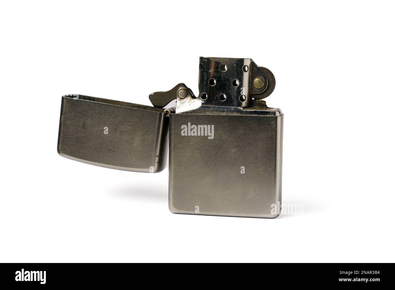 Metal gasoline lighter with an open lid on a white background Stock ...