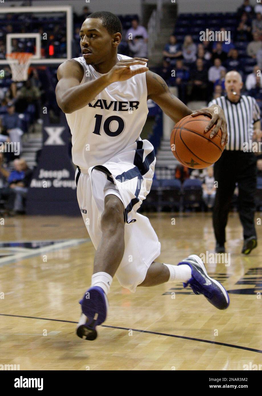 Xavier guard Mark Lyons drives against IPFW in an NCAA college ...