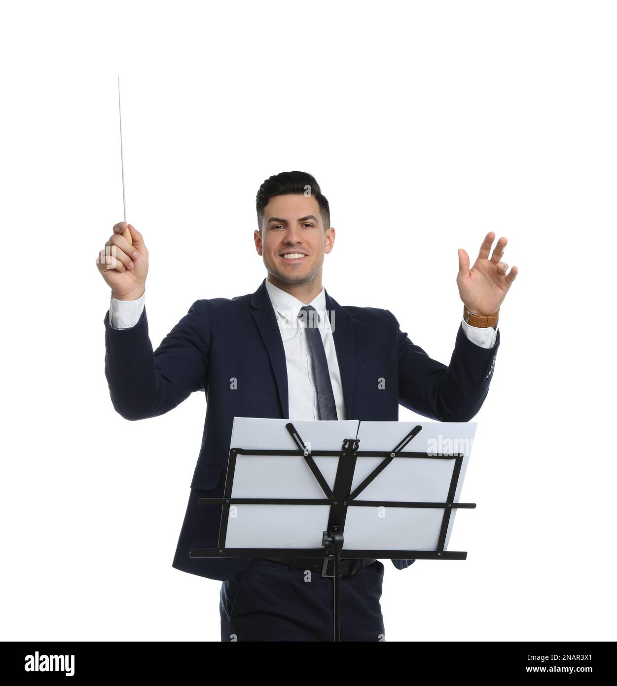 Music teacher with baton and note stand on white background Stock Photo ...