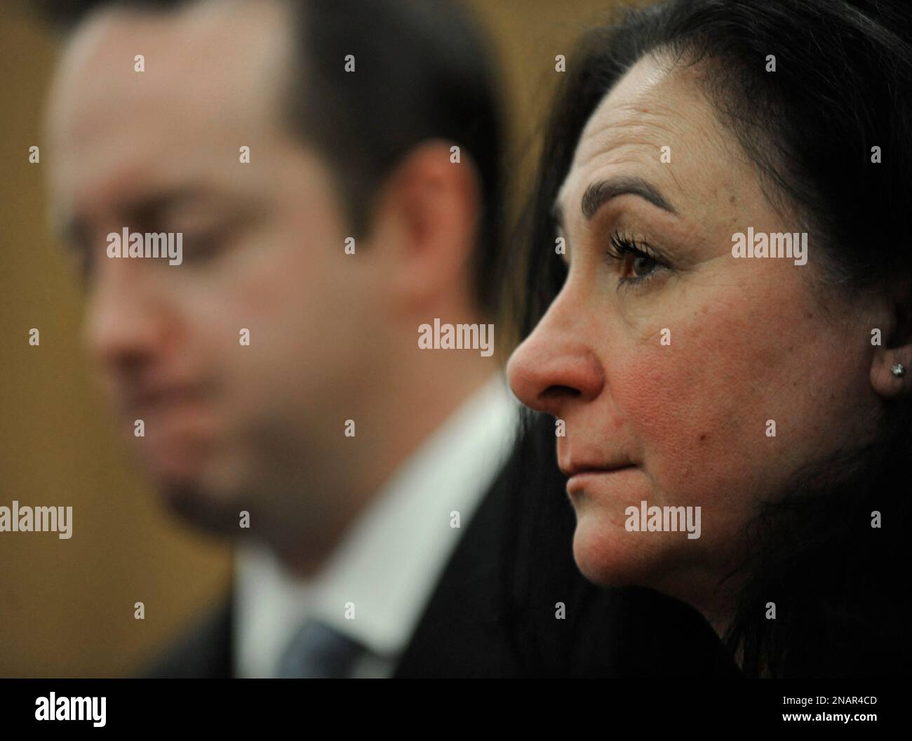 Laura O'Leary, sister of William Bundy, listens to Cook County Sheriff ...