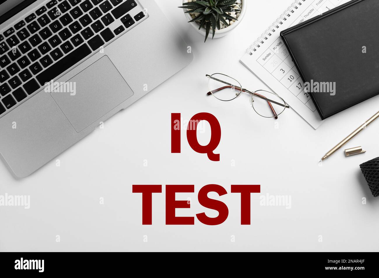 IQ Test. Composition with laptop, glasses and stationery on white ...