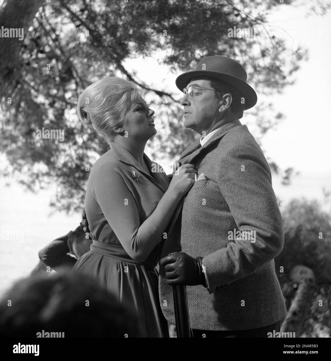 Swedish actress Anita Ekberg and Italian actor Claudio Gora embrace in ...