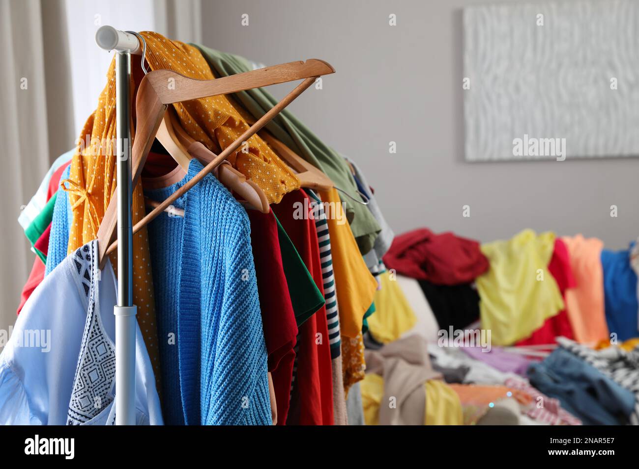 Mess of clothes all over room. Fast fashion Stock Photo - Alamy