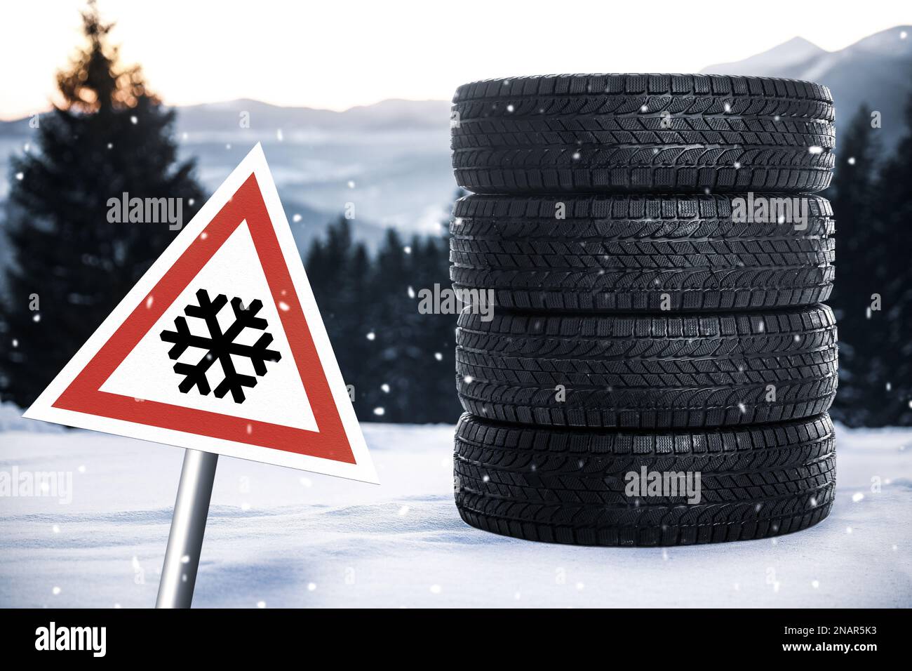 Set of winter tires and road sign outdoors Stock Photo - Alamy