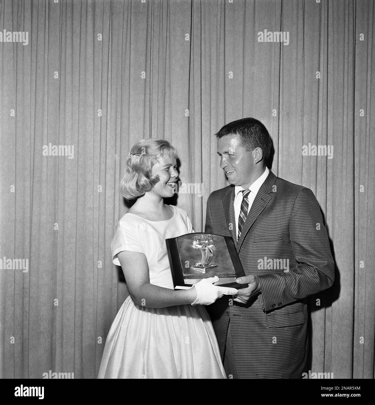 Rookie race driver Jim Hurtubise, of Lennox, Calif., receives a plaque ...