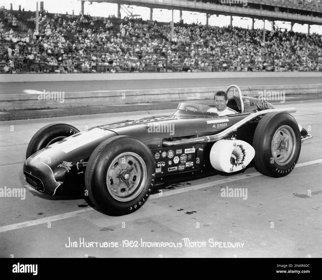Race car driver Jim Hurtubise sitting in his carr at Indianapolis ...