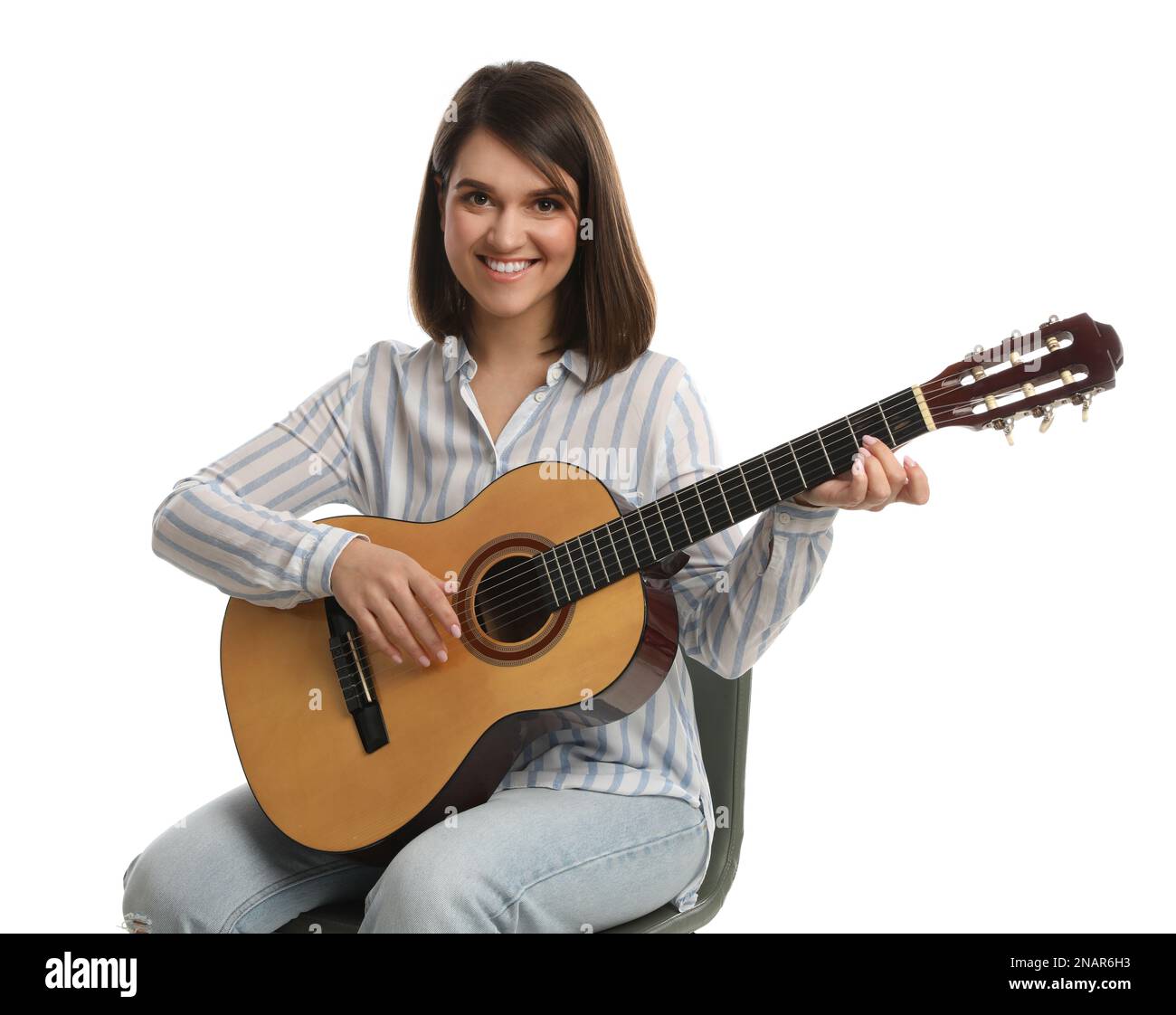 Music teacher playing guitar on white background Stock Photo - Alamy
