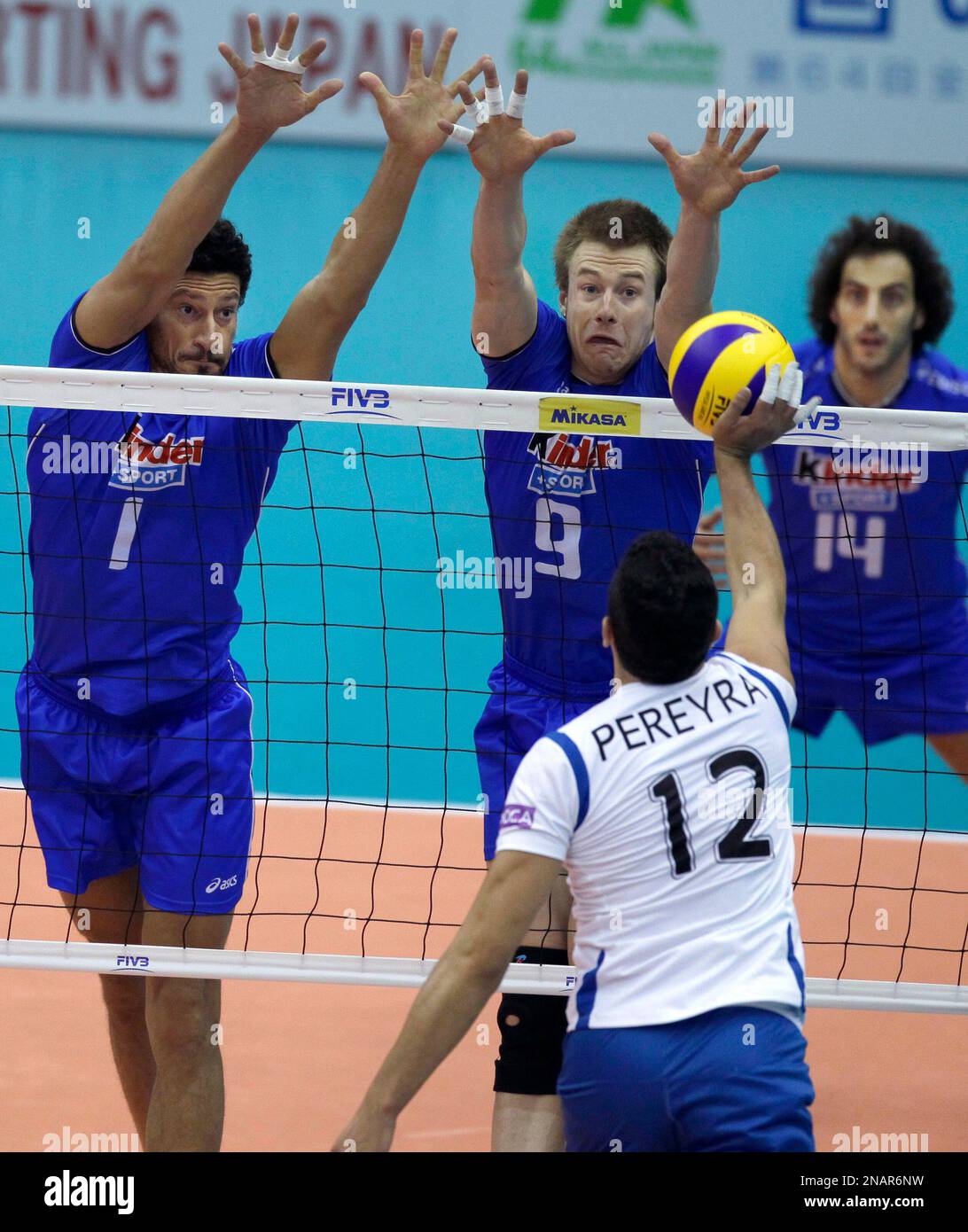 Italy's Luigi Mastrangelo (1) and Ivan Zaytsev (9) jump to block a ...
