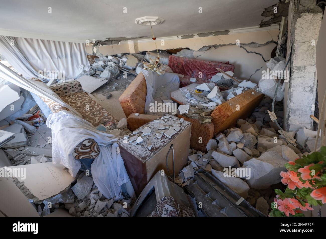 13 February 2023, Turkey, Ördekdede: Sofas, table and TV lie inside a ...