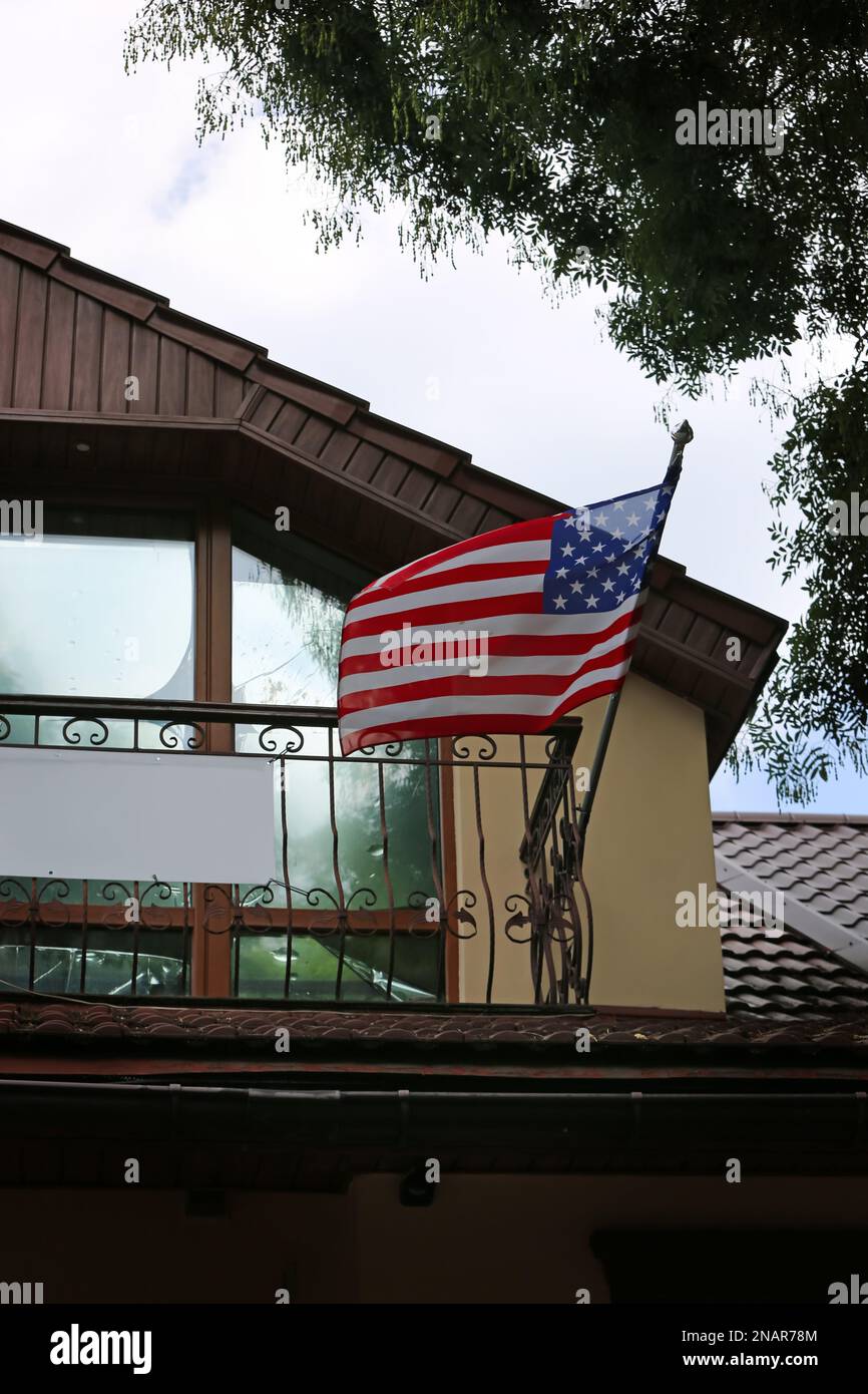 National flag of USA on building facade Stock Photo - Alamy