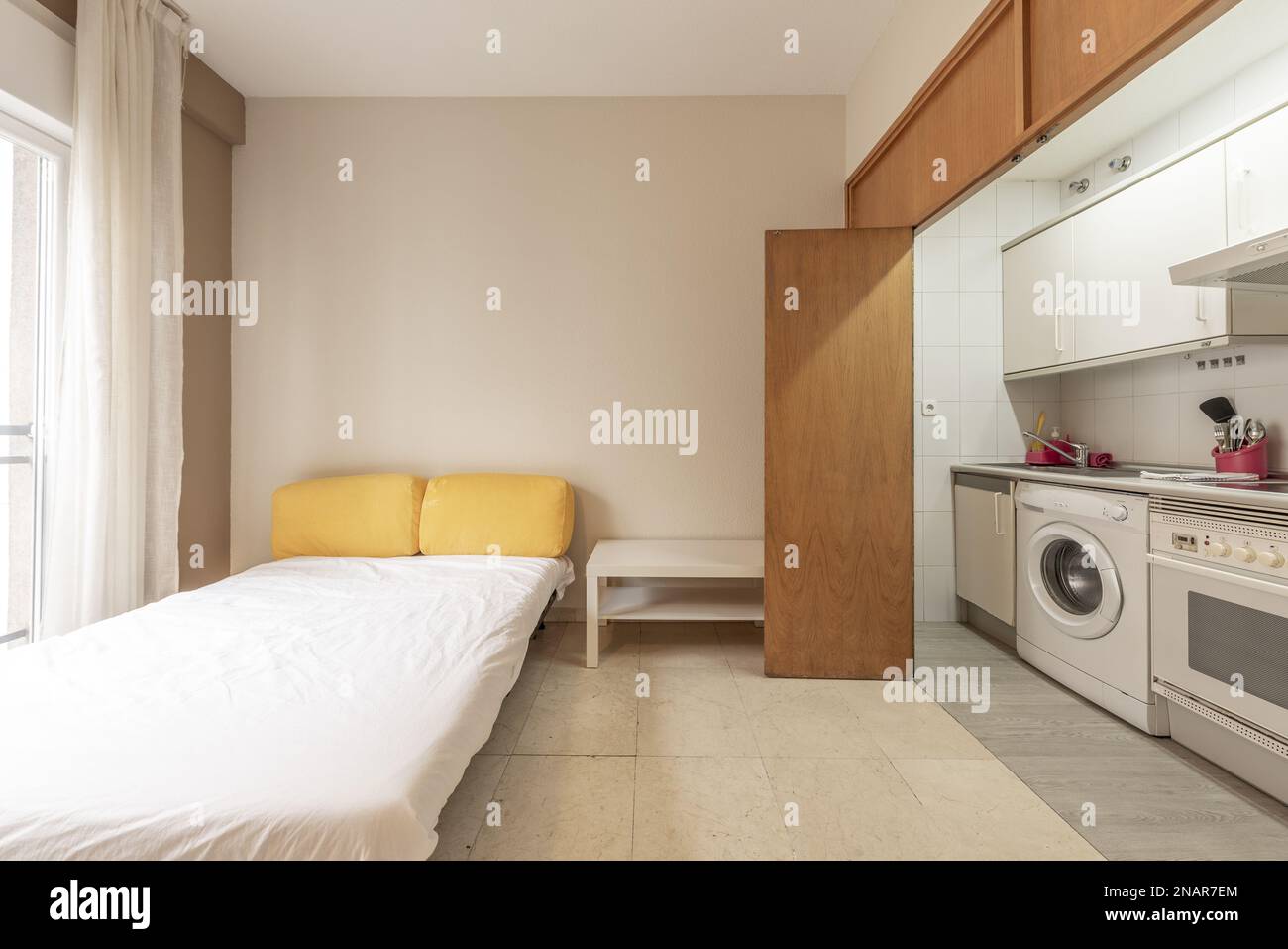 Studio apartment with kitchen behind oak doors and polished marble ...