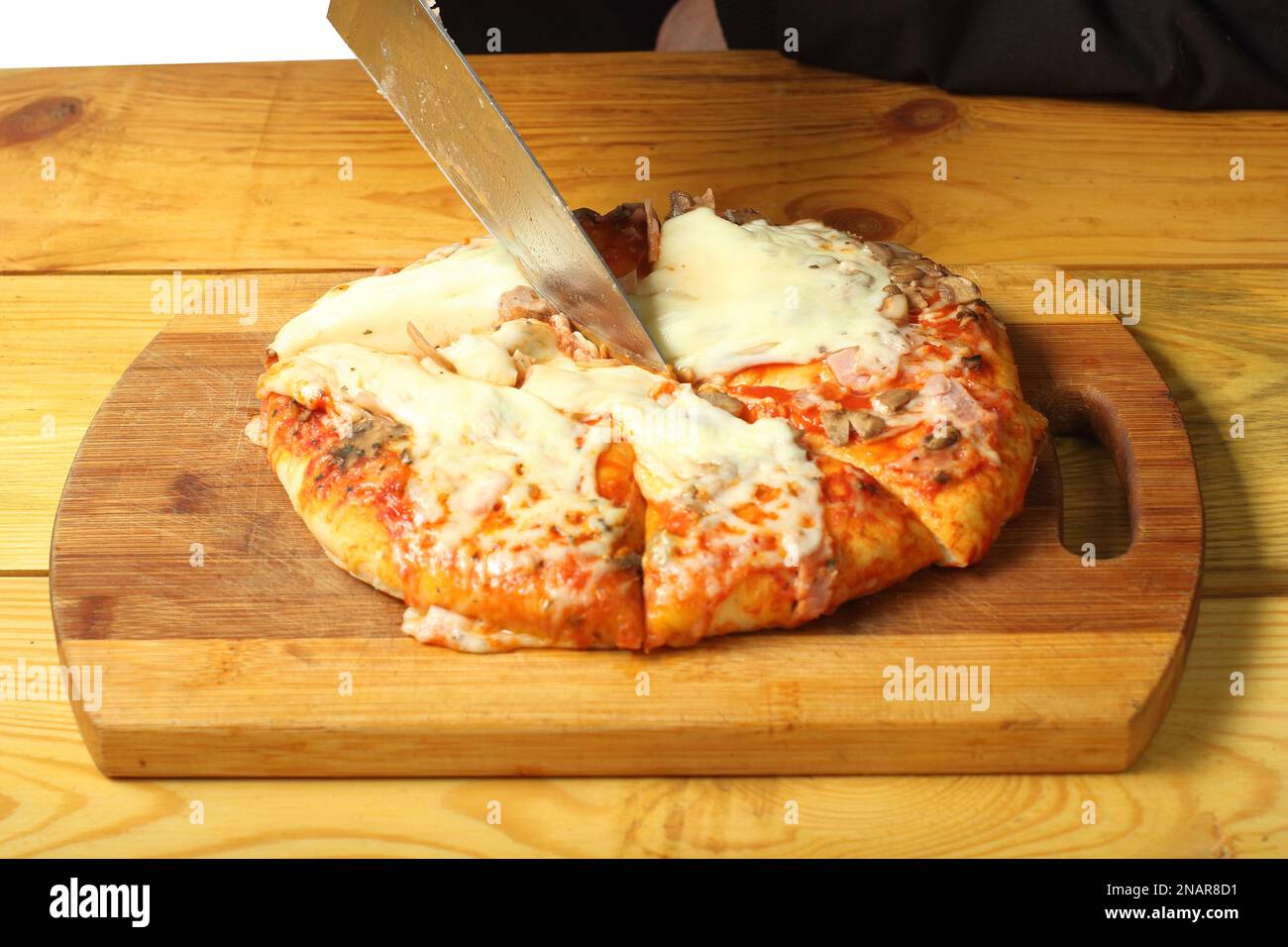 Hand cutting pizza table cheese hi-res stock photography and images - Alamy