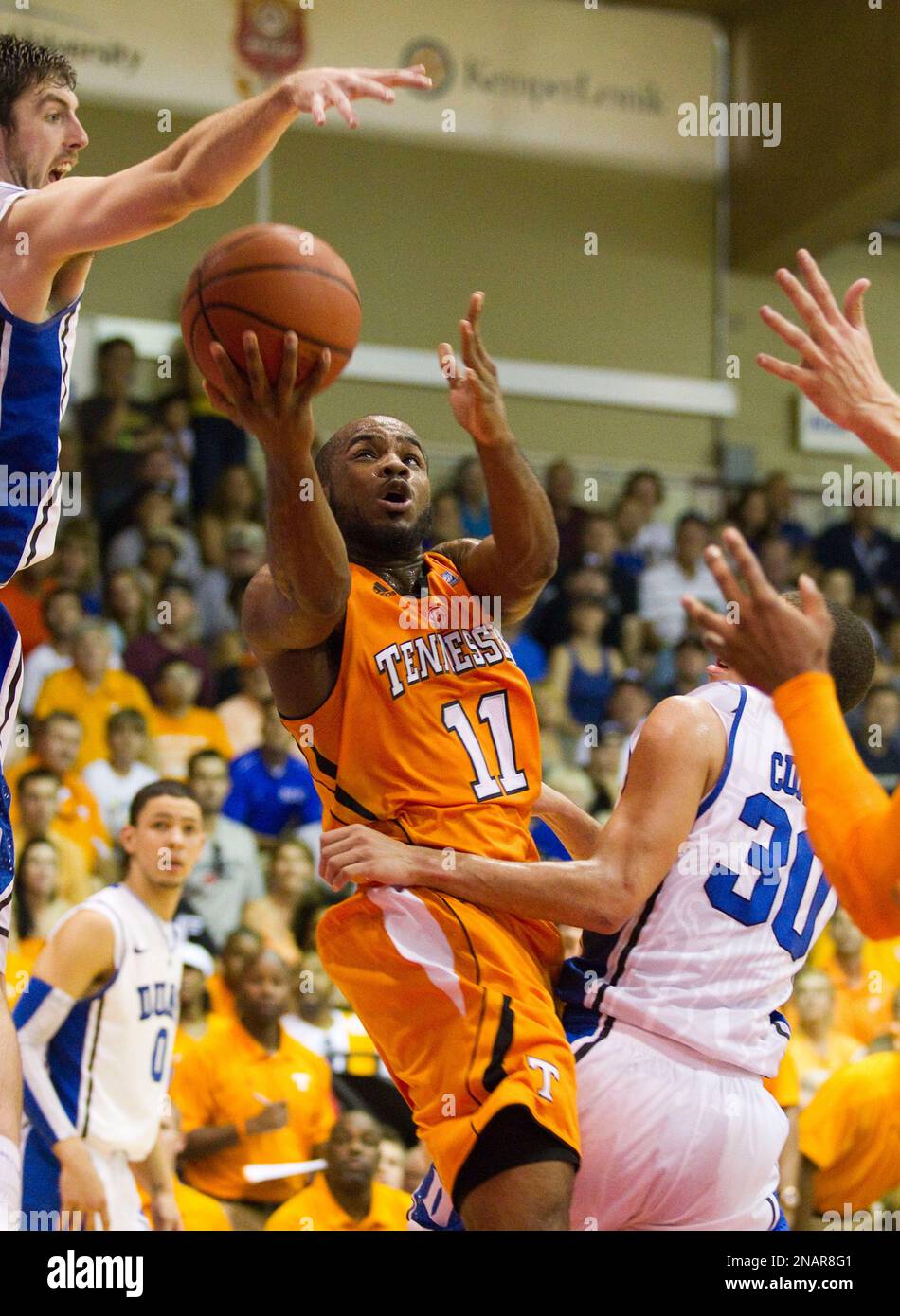 Tennessee guard Trae Golden (11) puts up a shot while being deeded by ...