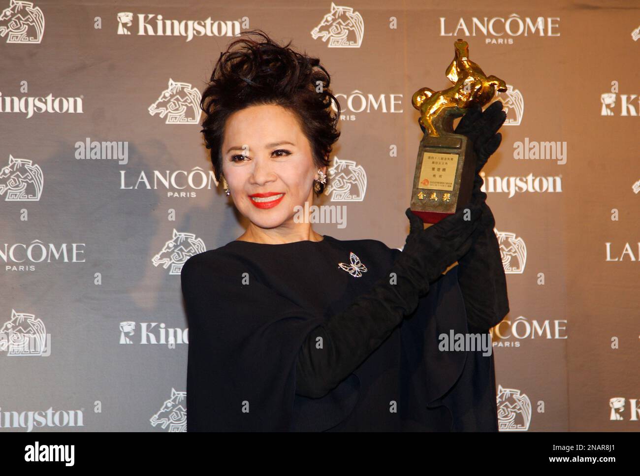 Hong Kong actress Deanie Ip poses with her award for Best Leading ...