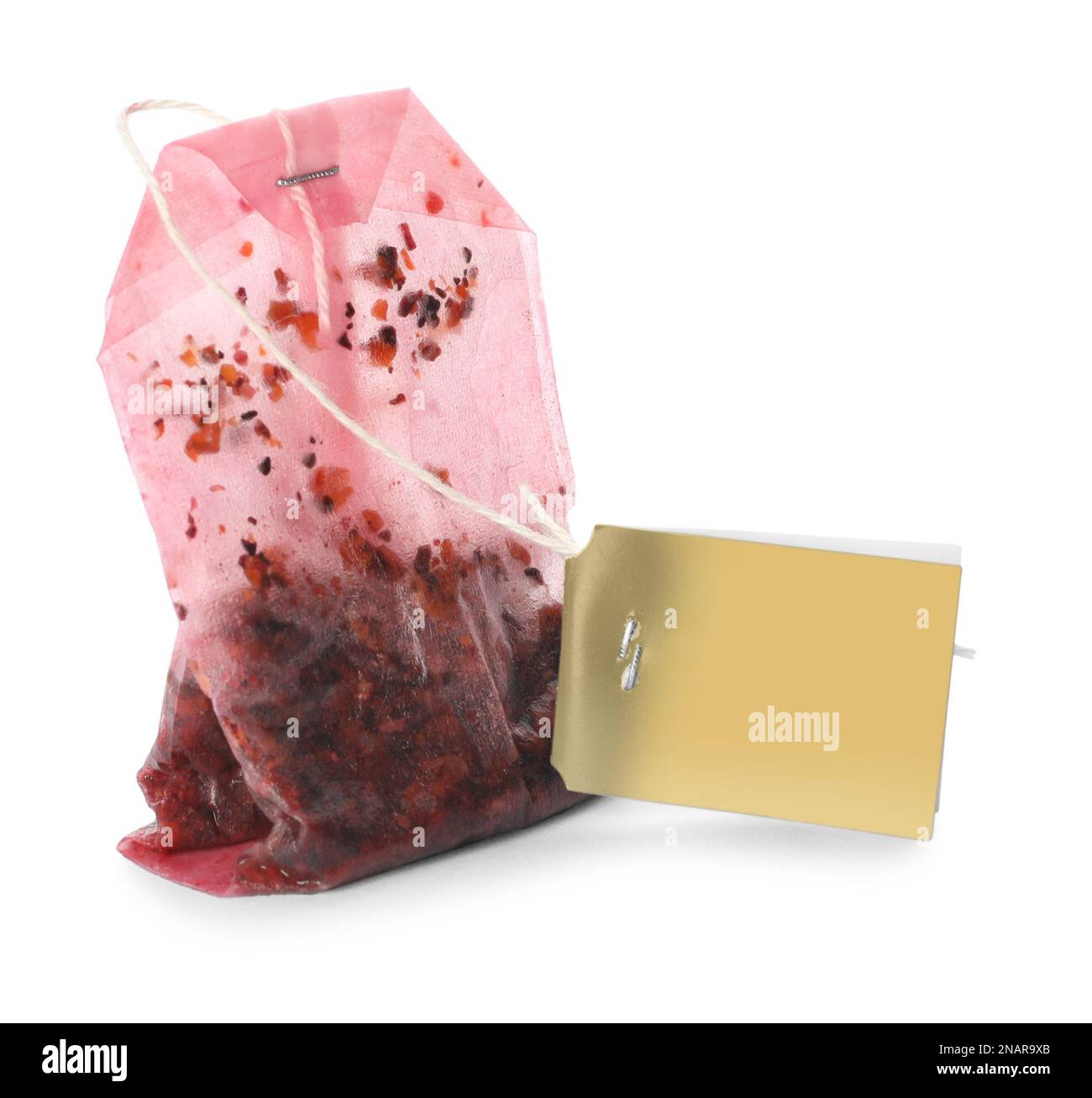 Used tea bag with tag on white background Stock Photo - Alamy