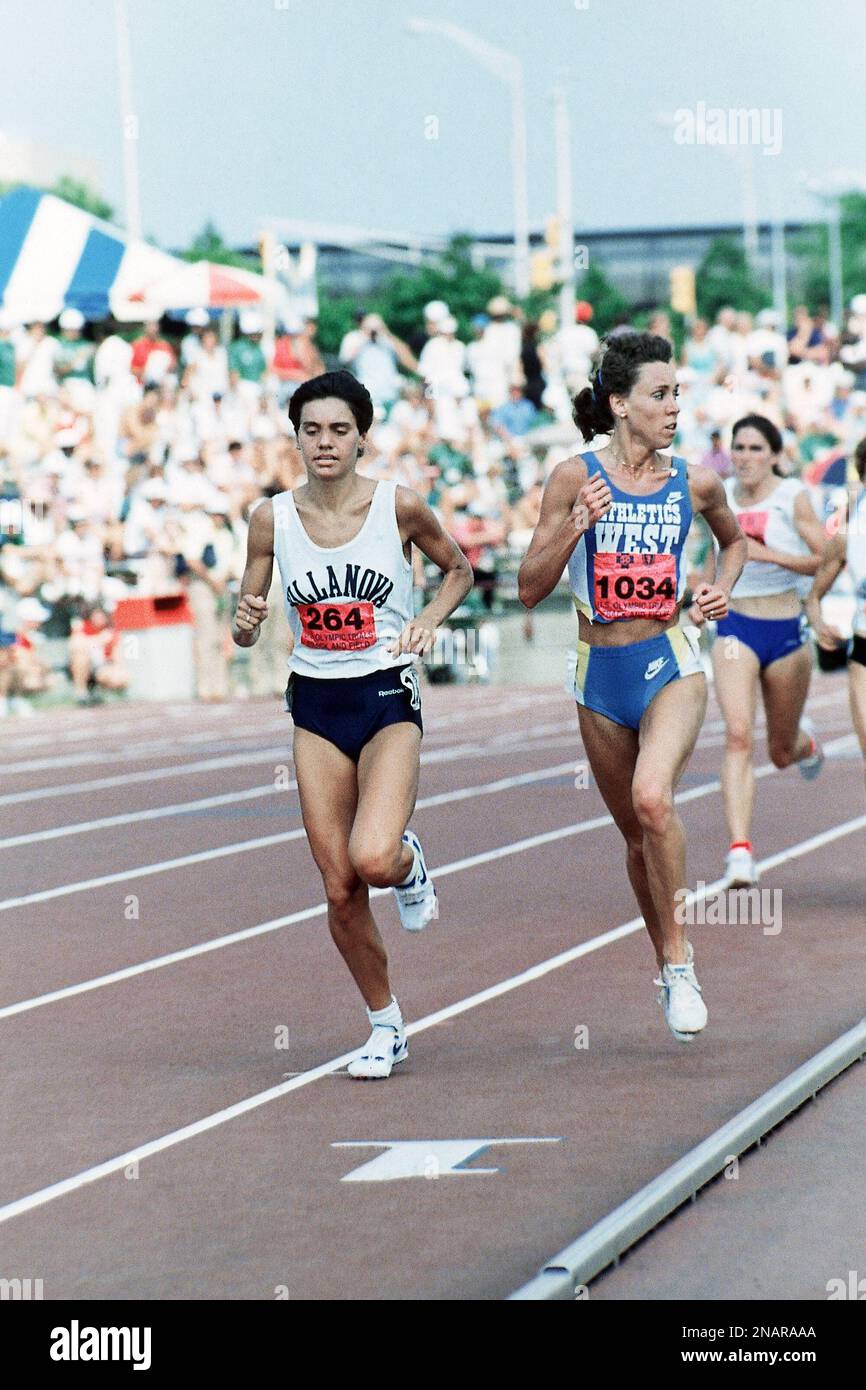Vicki Huber, left, and Mary Slaney duel down the back stretch in the ...