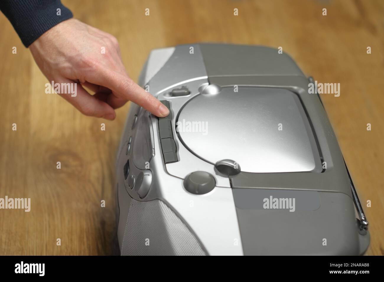 person presses cassette drawer opening button in cd player Stock Photo ...