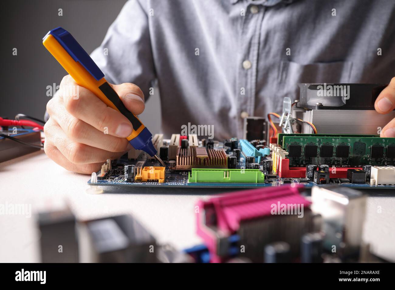 Repairing electronic circuit board hi-res stock photography and images ...