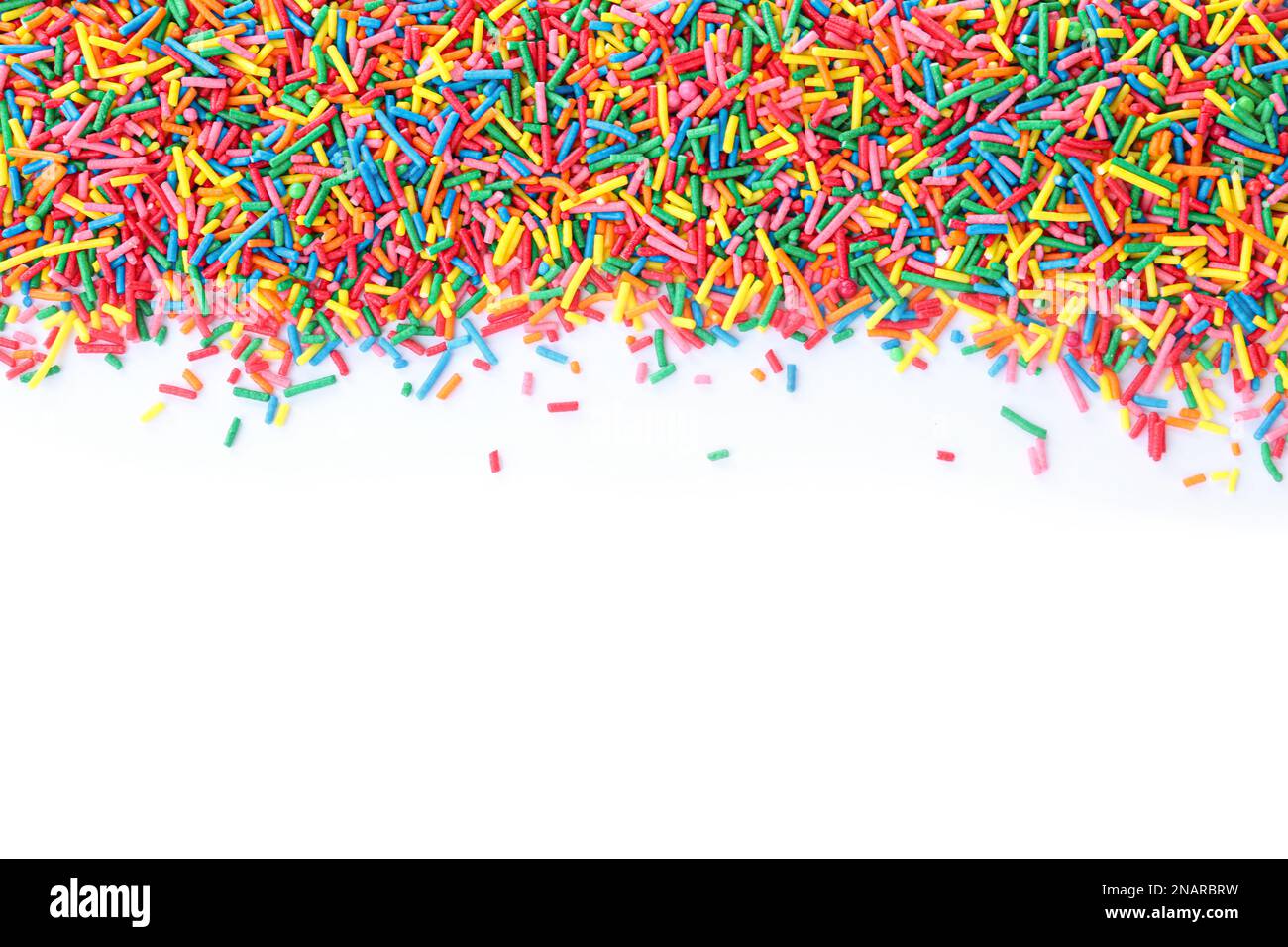 Colorful sprinkles on white background, top view. Confectionery decor ...