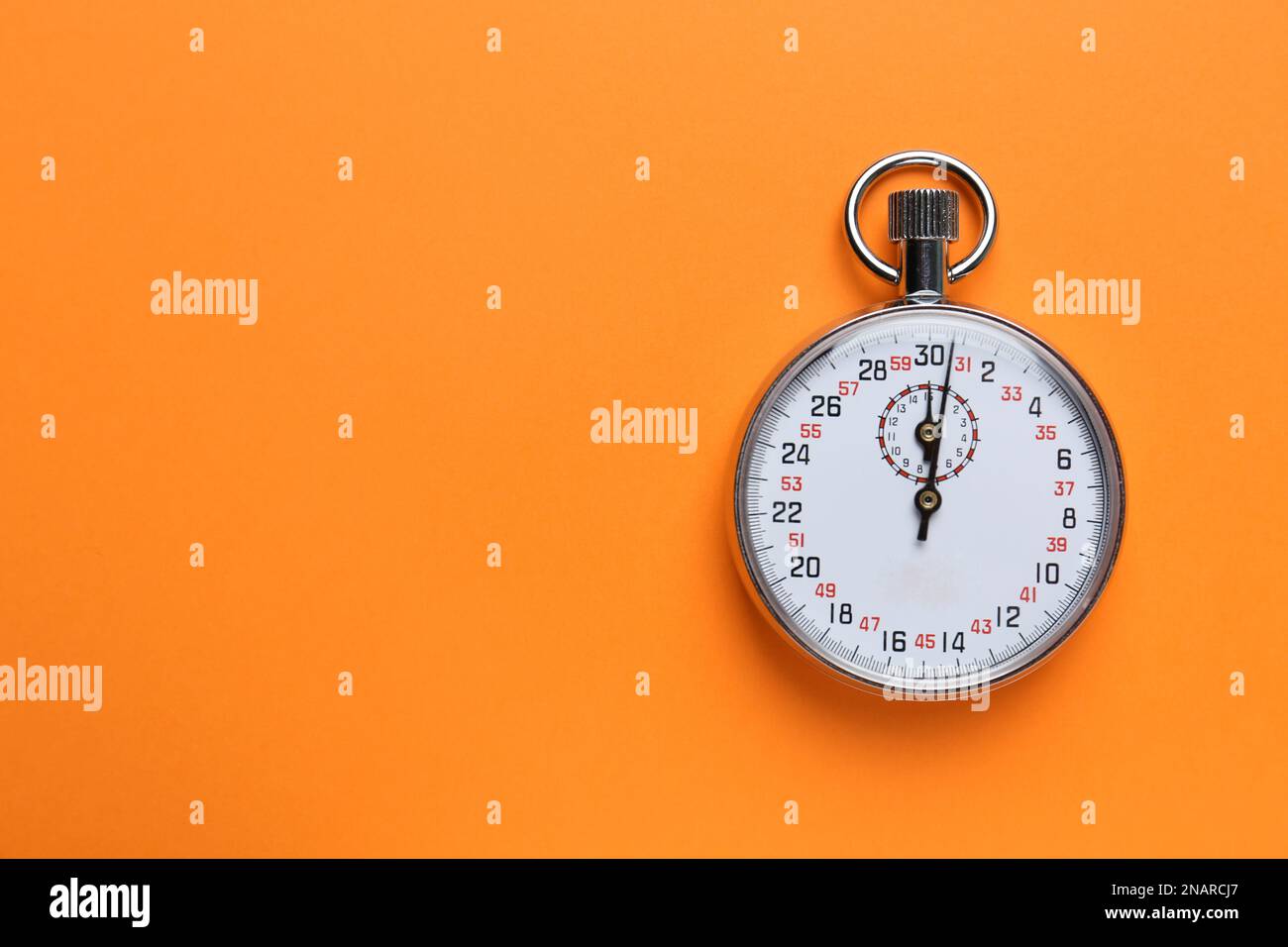 Vintage timer on orange background, top view. Space for text Stock ...