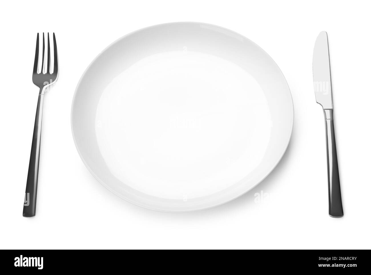 Empty plate and cutlery on white background. Table setting Stock Photo ...