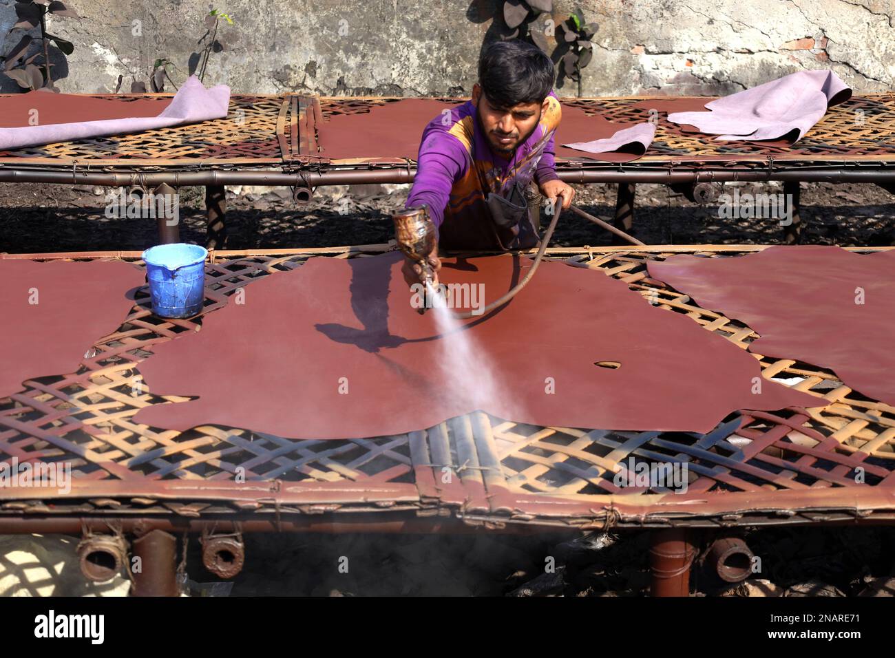 Dhaka, Dhaka, Bangladesh. 13th Feb, 2023. Workers dye leather and dry ...