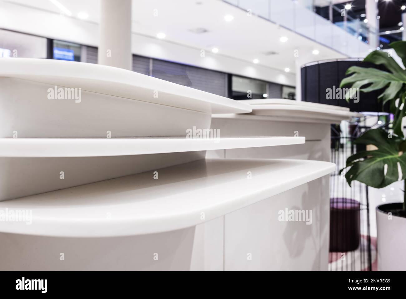 Synthetic material reception desk in a shopping center Stock Photo - Alamy
