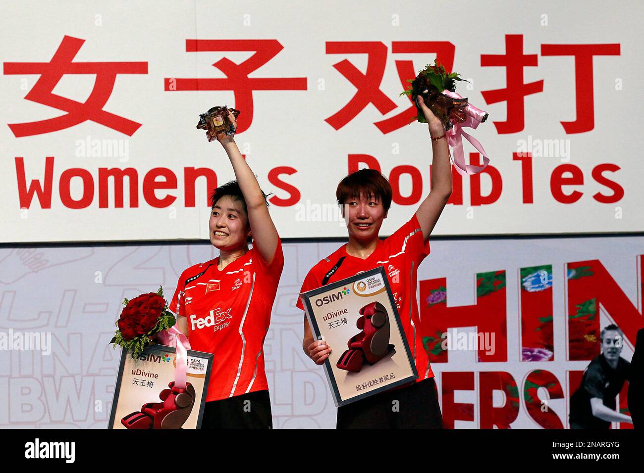 China's Yu Yang, left, and Wang Xiaoli, celebrate during the award ...