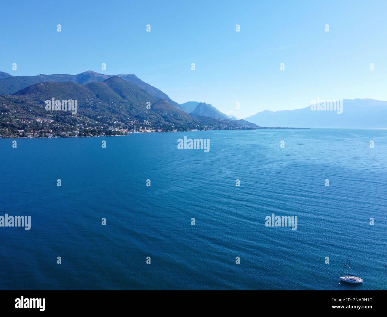 Clear blue water of Lake Garda around Portese, aerial view point from a ...