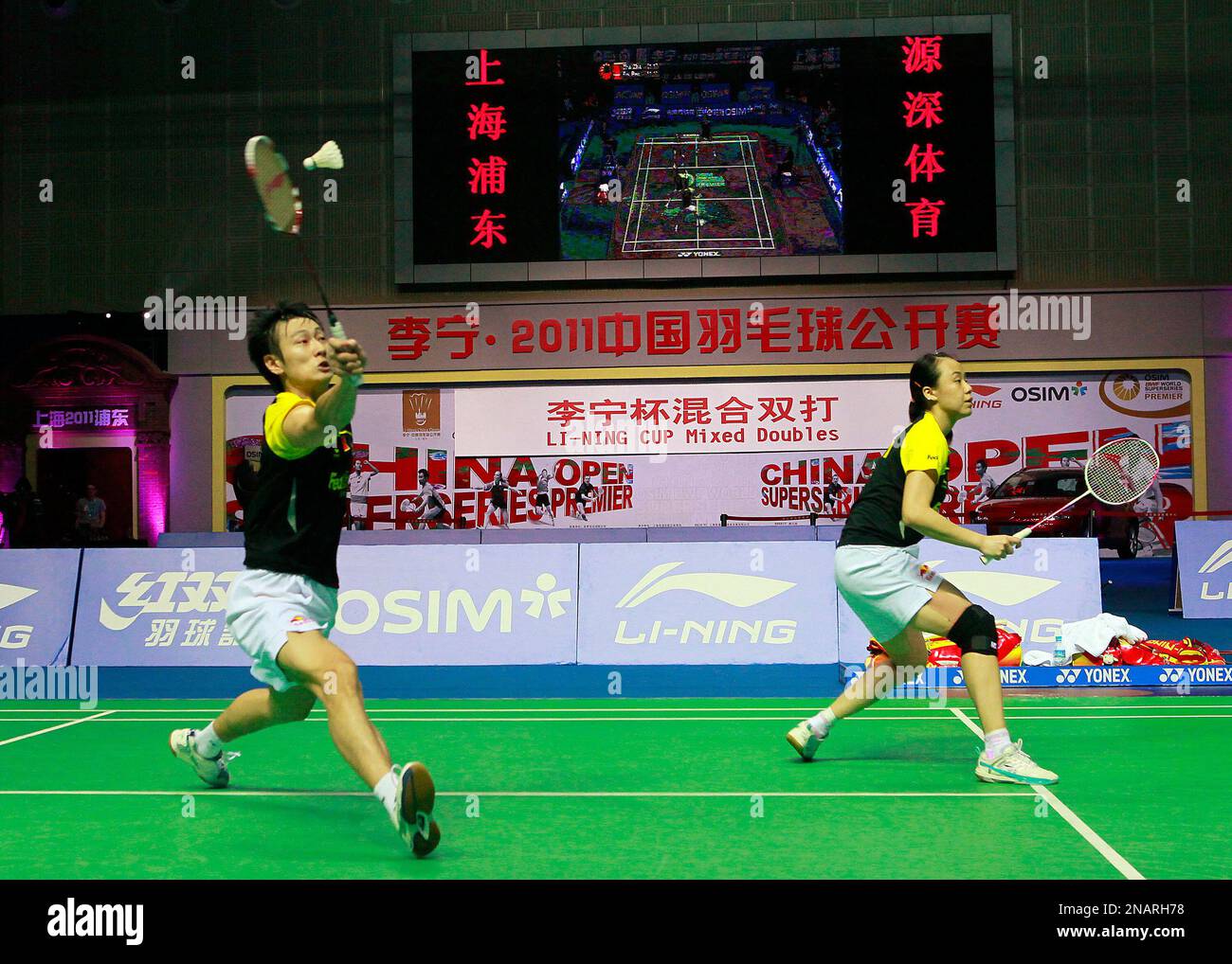 China's Zhang Nan, left, and Zhao Yunlei, right, play against Denmark's ...