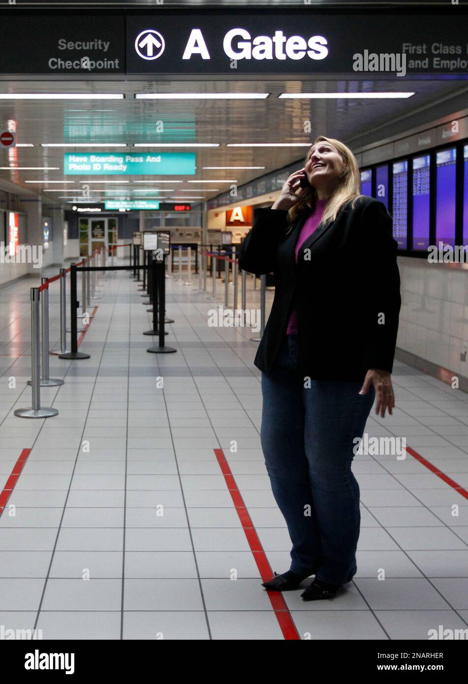 Joy Sweeney, mother of Derrik Sweeney, talks on a phone to a well ...