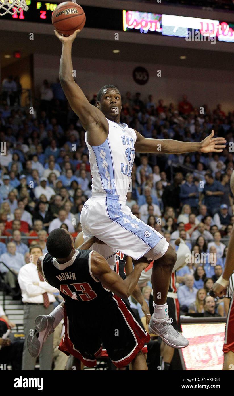North Carolina's Harrison Barnes, top, goes up for a shot as UNLV's ...
