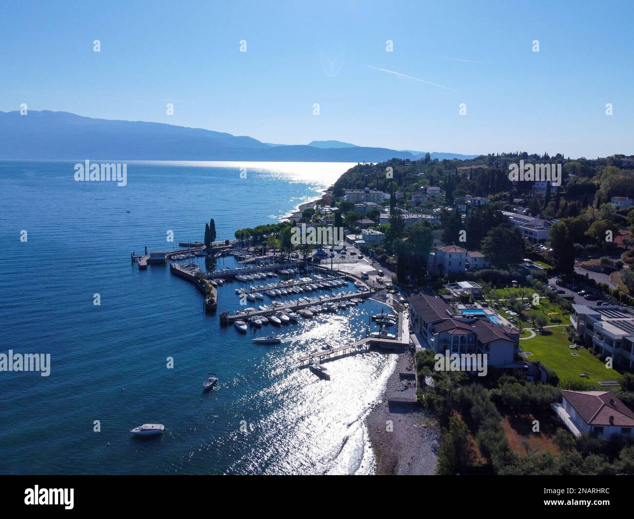 Clear blue water of Lake Garda around Portese, aerial view point from a ...