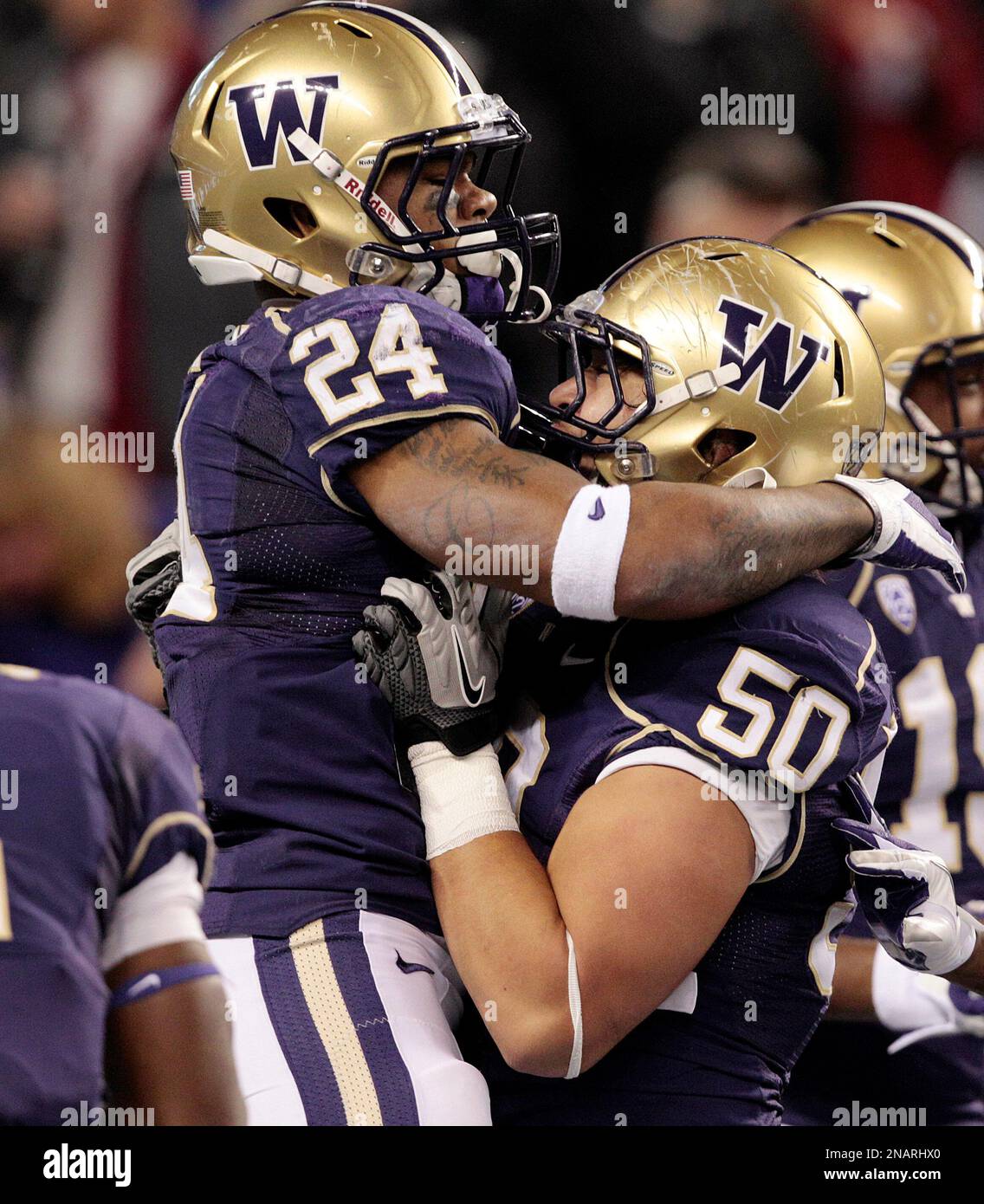 Washington's Jesse Callier (24) celebrates with Thomas Tutogi after ...