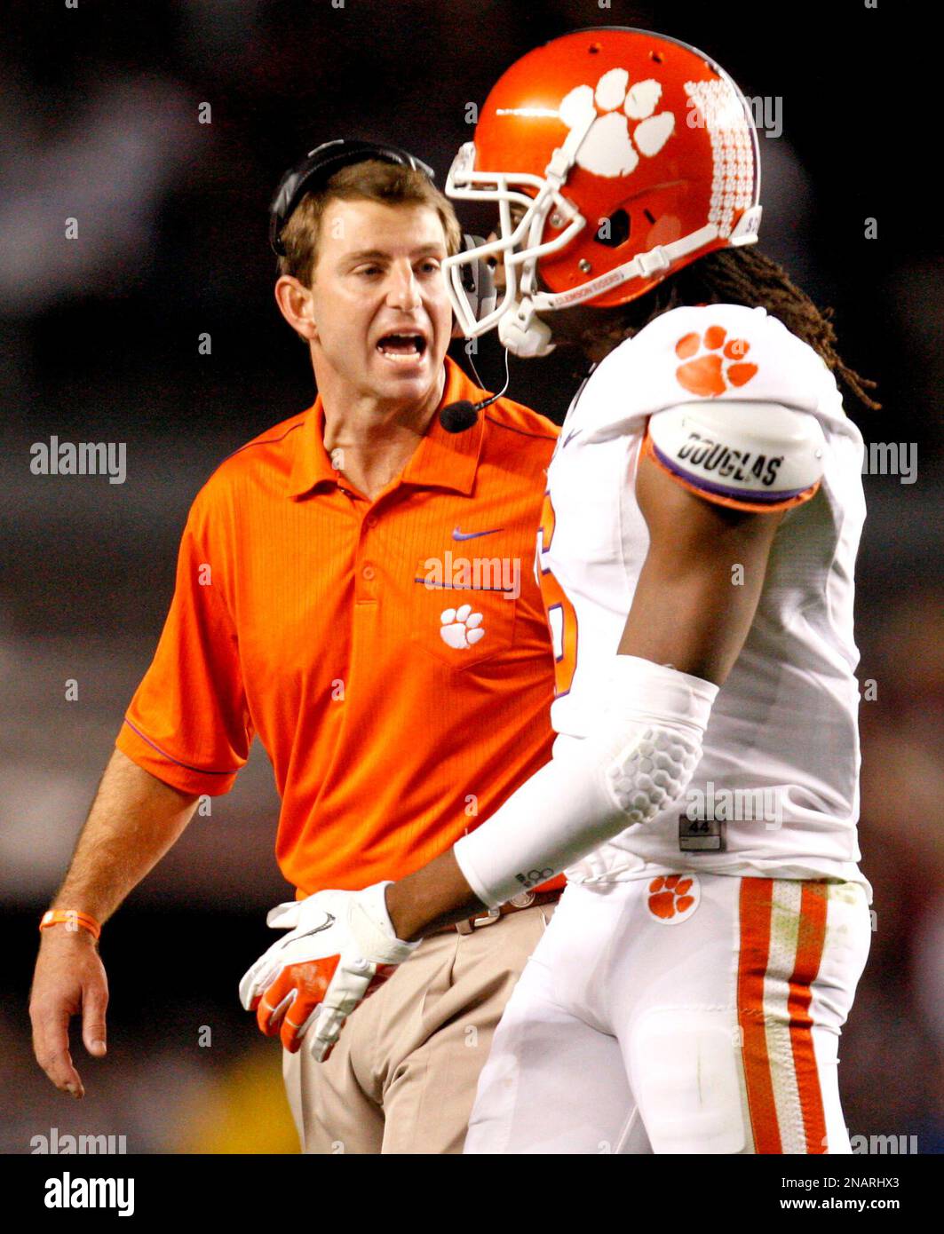 Clemson coach Dabo Swinney talks with South Carolina defensive end ...