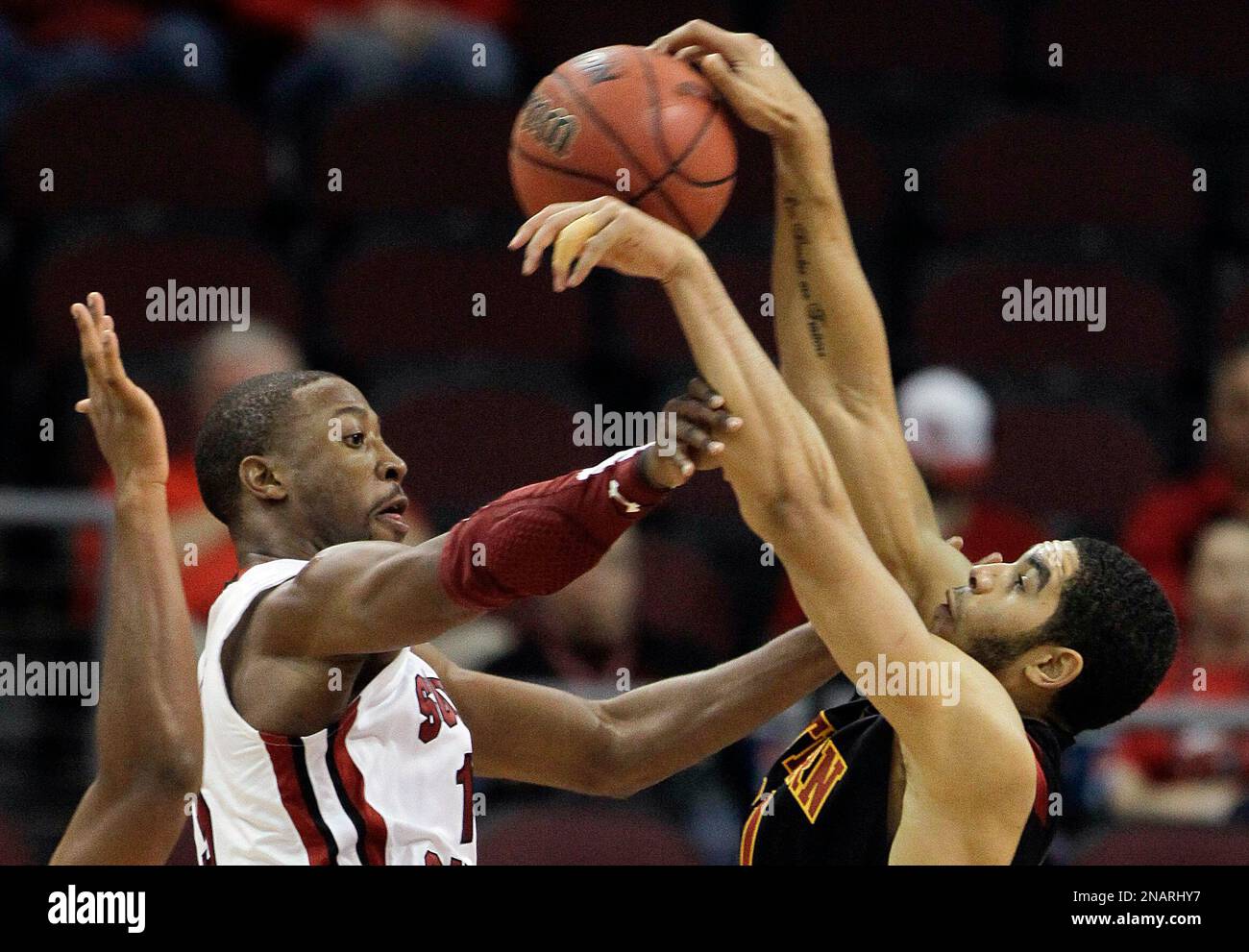 Southern California's Aaron Fuller, right, passes the ball over South ...
