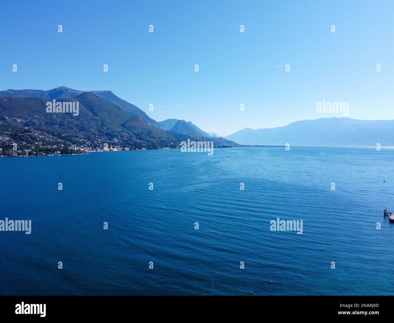 Clear blue water of Lake Garda around Portese, aerial view point from a ...