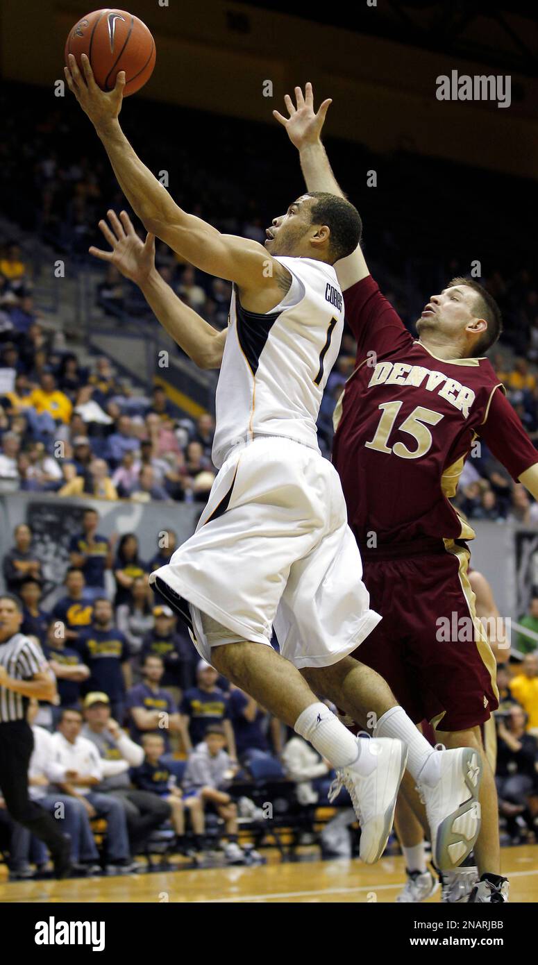 California's Justin Cobbs (1) drives to the basket past Denver's Travis ...