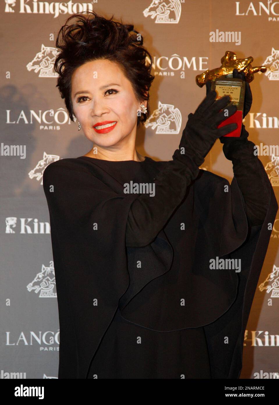 Hong Kong actress Deanie Ip holds her awards for Best Leading Actress ...