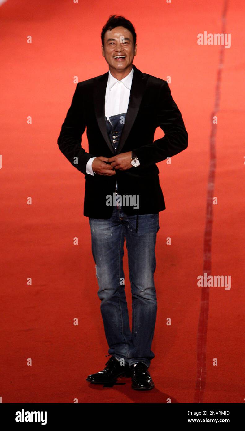Chinese actor Simon Yam poses on the red carpet at the 48th Golden ...