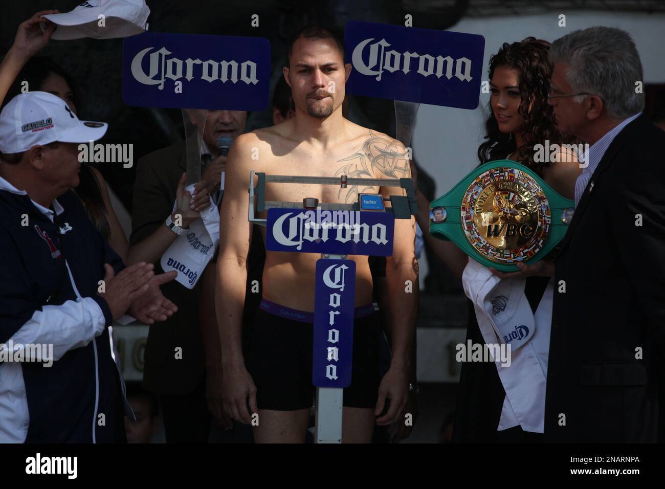 Boxer Kermit Cintron, of Puerto Rico, stands on the scales during the ...