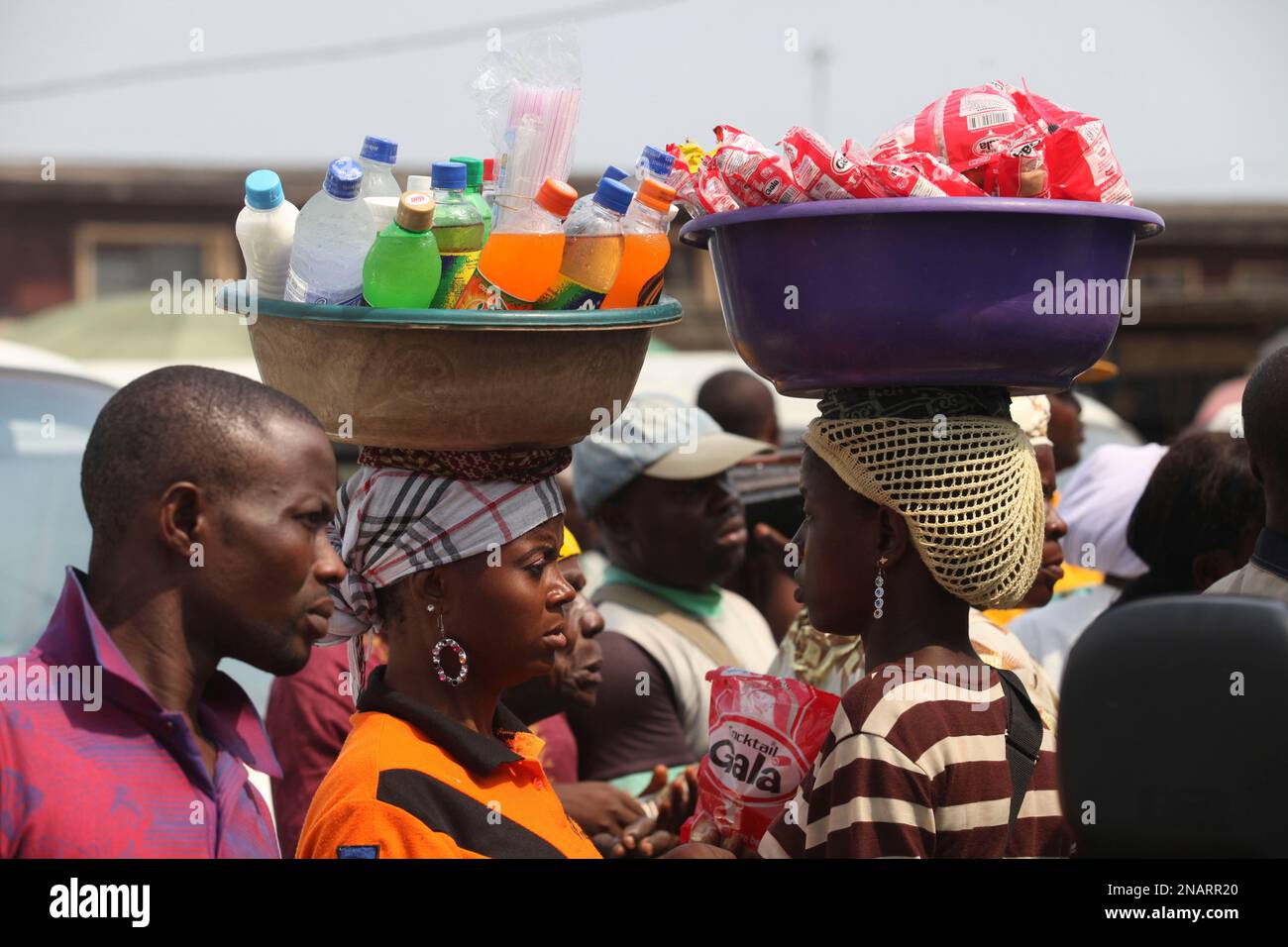 Women sells snacks at Ojota bus terminal in Lagos, Nigeria, Friday, Nov ...
