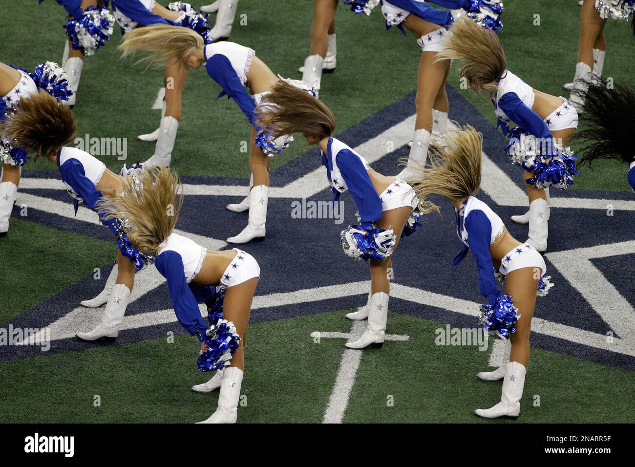 Dallas Cowboys cheerleaders perform before an NFL football game against ...