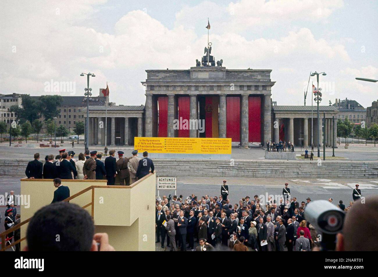 Standing on a platform overlooking the wall dividing East and West ...