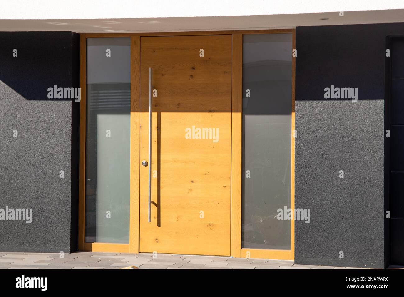 Modern new wooden front door Stock Photo - Alamy