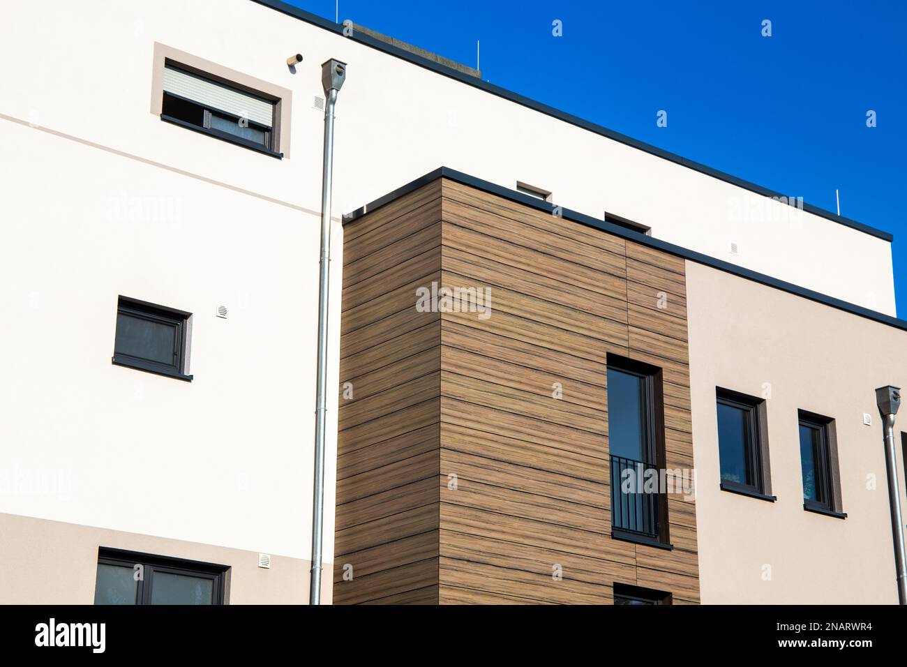 Modern facade with wooden panels on a new apartment building Stock ...